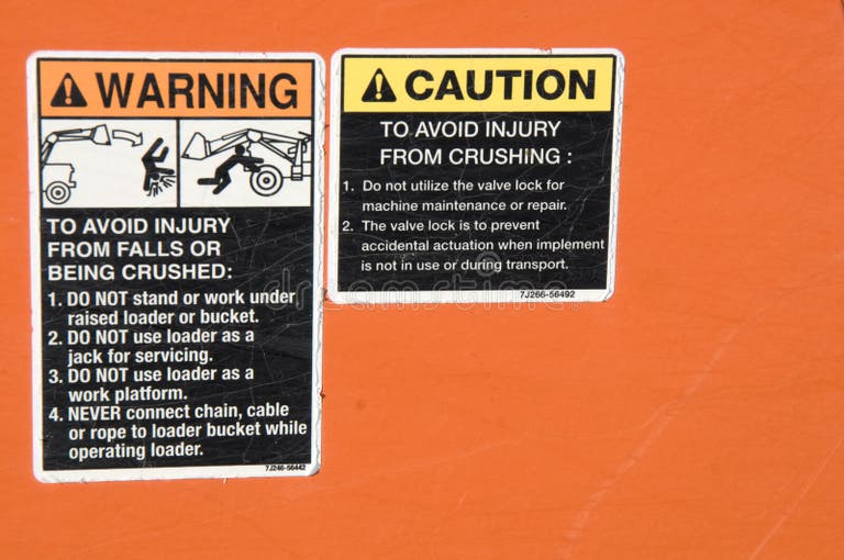 An Orange Caution Sticker on Front End Loader Tractor. Stock Photo ...