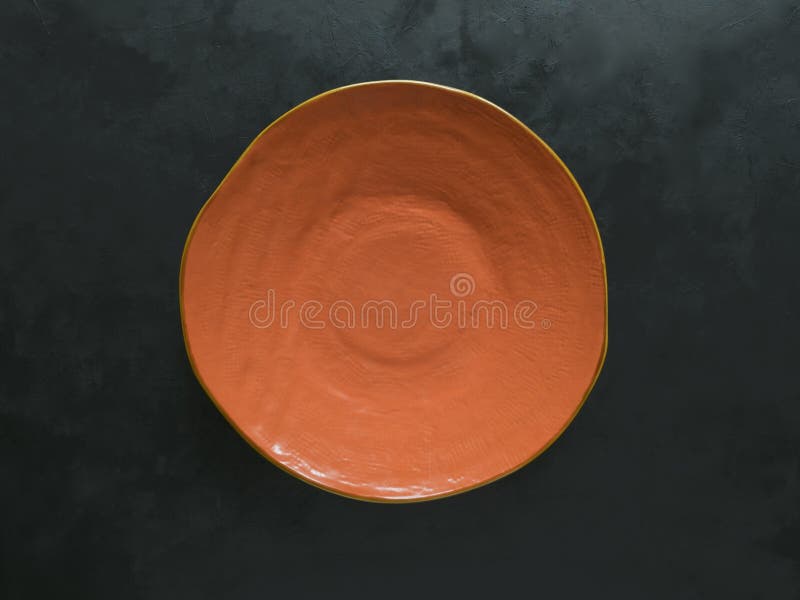 Orange Ceramic Plate Handmade on Black Background. Stock Image - Image ...