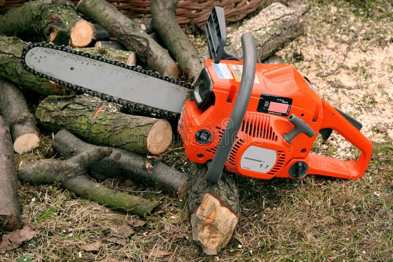 Orange chainsaw stock image. Image of wood, equipment, sawdust - 637881