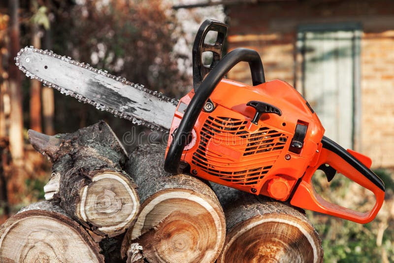 ORANGE CHAINSAW stock photo. Image of chainsaw, woodcutter - 5258138