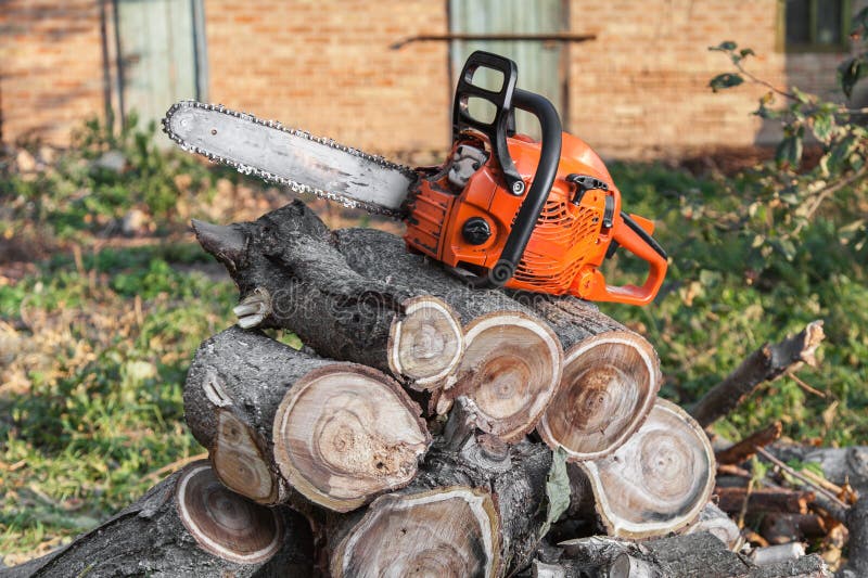 Orange chainsaw stock image. Image of wood, equipment, sawdust - 637881