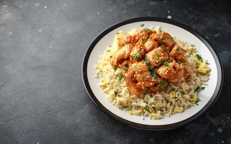 Orange Chicken Spicy Sweet and Sour with Fried Eggs Rice in a Plate ...