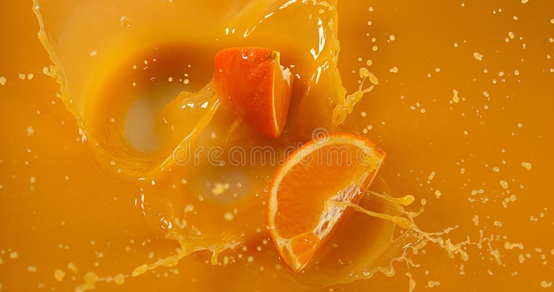 Orange, Citrus Sinensis, Fruit Falling into Orange Juice Stock Photo ...
