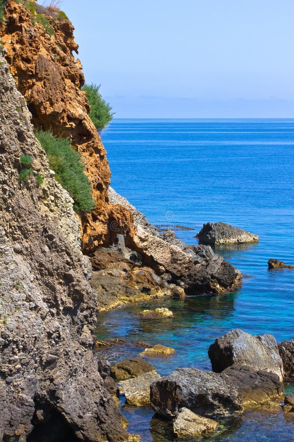 Orange cliff stock photo. Image of stone, water, ocean - 22437746
