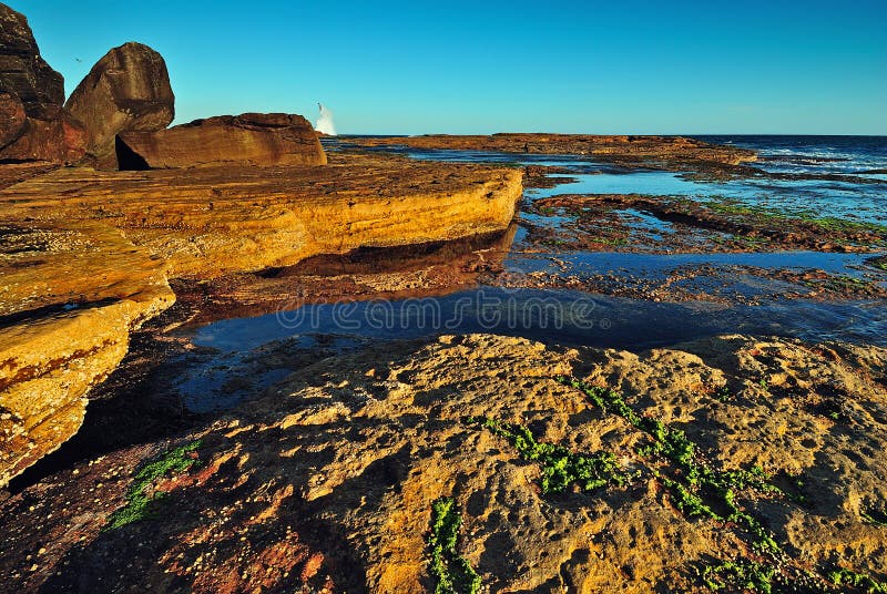 Orange cliffs seascape stock image. Image of beach, ocean - 54483627