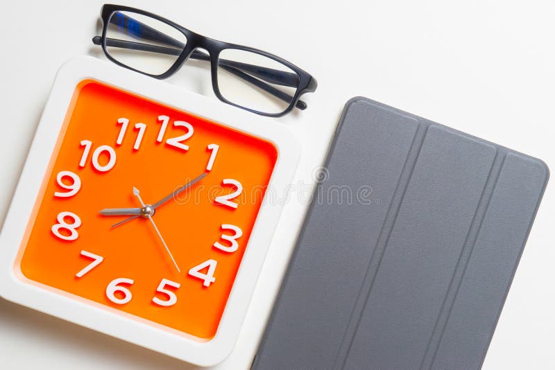 Orange Clock Glass and Tablet Stock Photo - Image of work, workplace ...