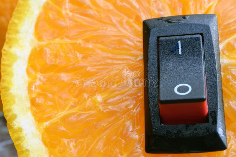 Orange Close Up with with Inserted Power Switch. Stock Photo - Image of ...