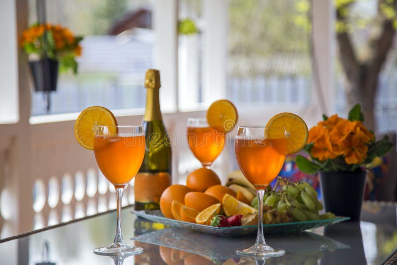 Orange Cocktail on the Background of Fruit on the Table. Stock Photo ...