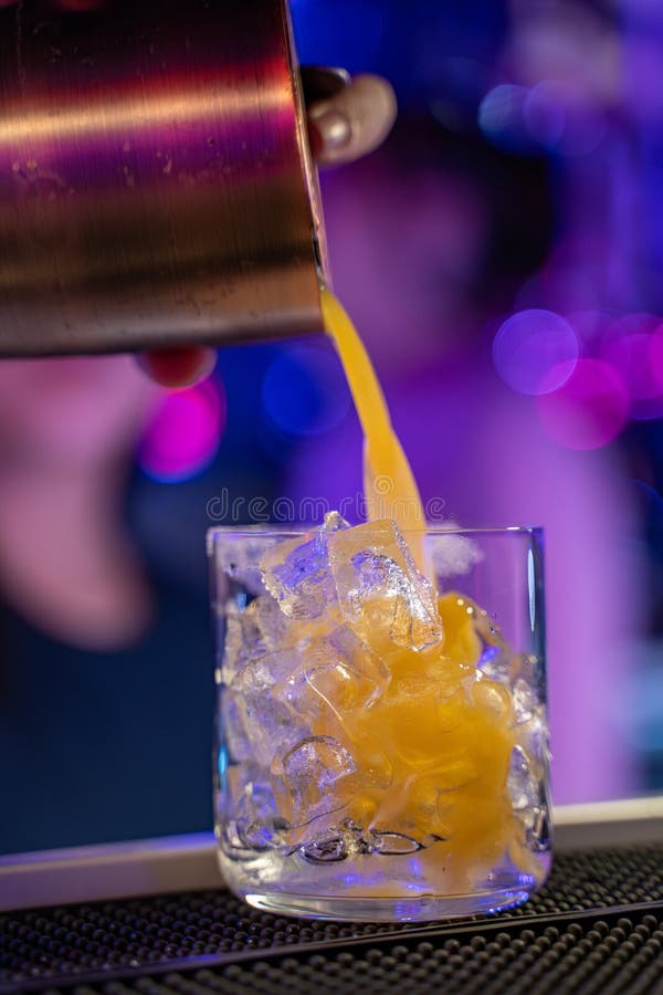 Orange Cocktail with Ice in a Glass at the Bar Stock Photo - Image of ...