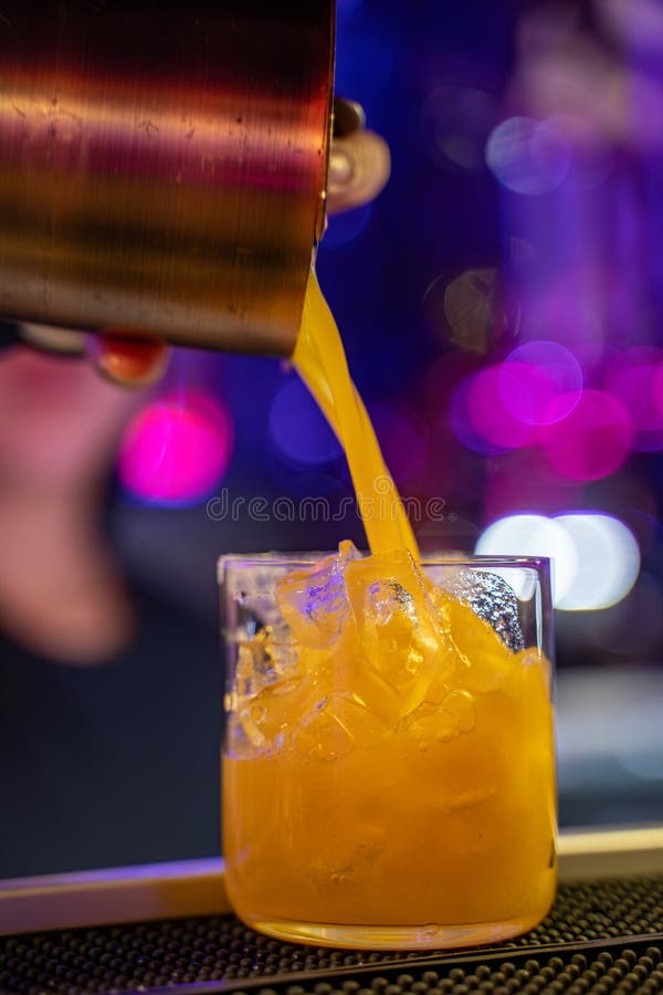 Orange Cocktail with Ice in a Glass at the Bar Stock Photo - Image of ...