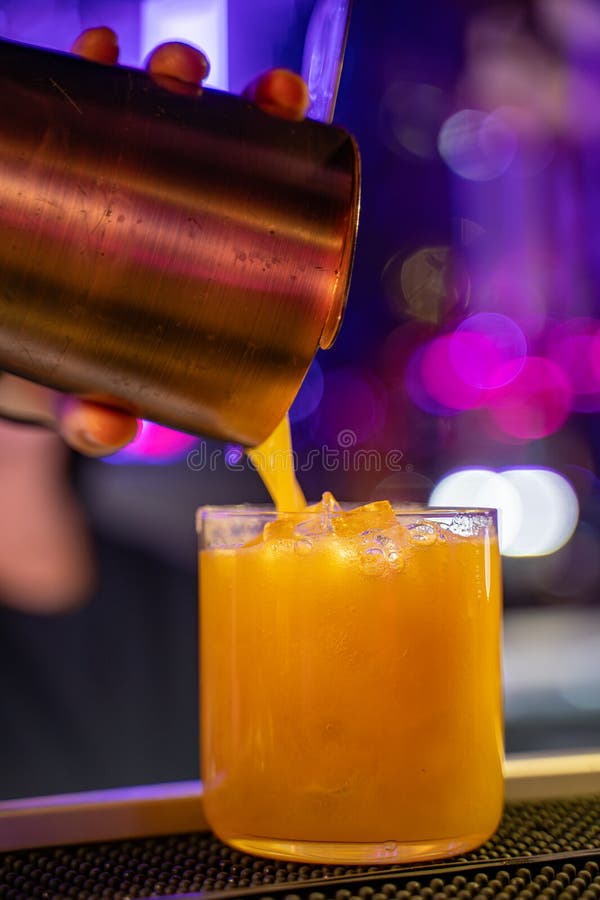 Orange Cocktail with Ice in a Glass at the Bar Stock Photo - Image of ...