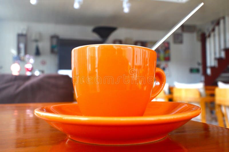 The orange coffee cup stock photo. Image of design, orange - 63562458
