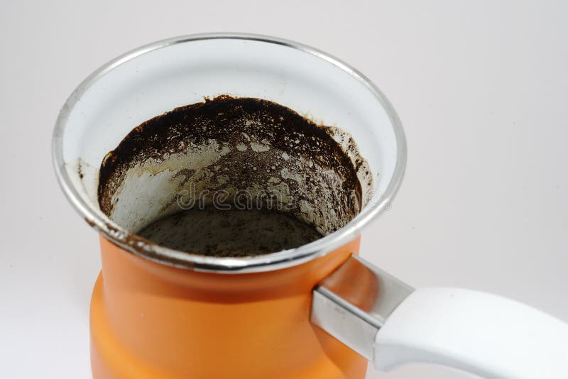 Orange Coffee Pot with Coffee Grounds Stock Photo - Image of component ...