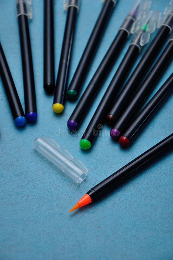 An Orange Color Pen with the Rest Out of Focus Stock Image - Image of ...