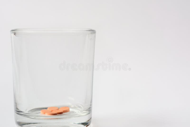 Orange Color Tablet Pills in Glass on White Background Stock Photo ...