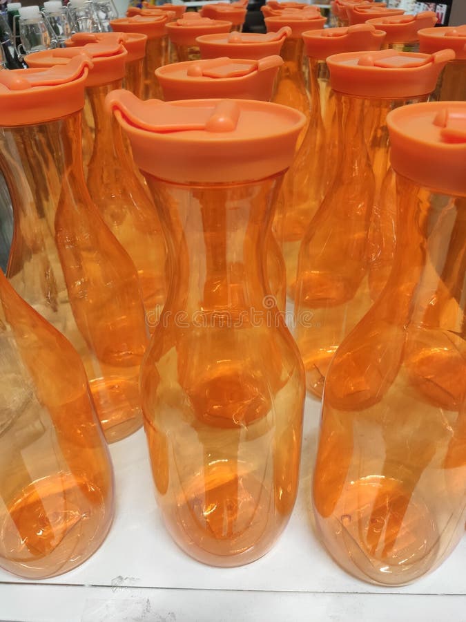 Orange colored bottles stock photo. Image of orange - 173387612