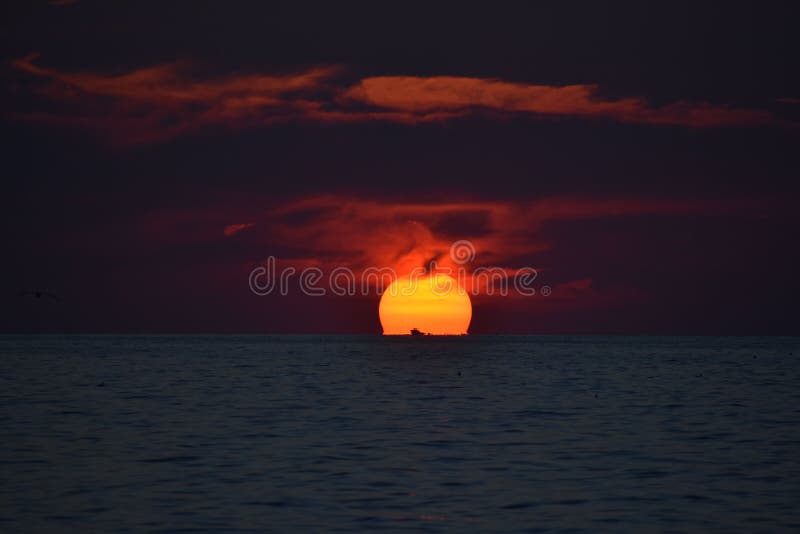 Orange-colored Sun Setting Over the Seascape Stock Image - Image of ...