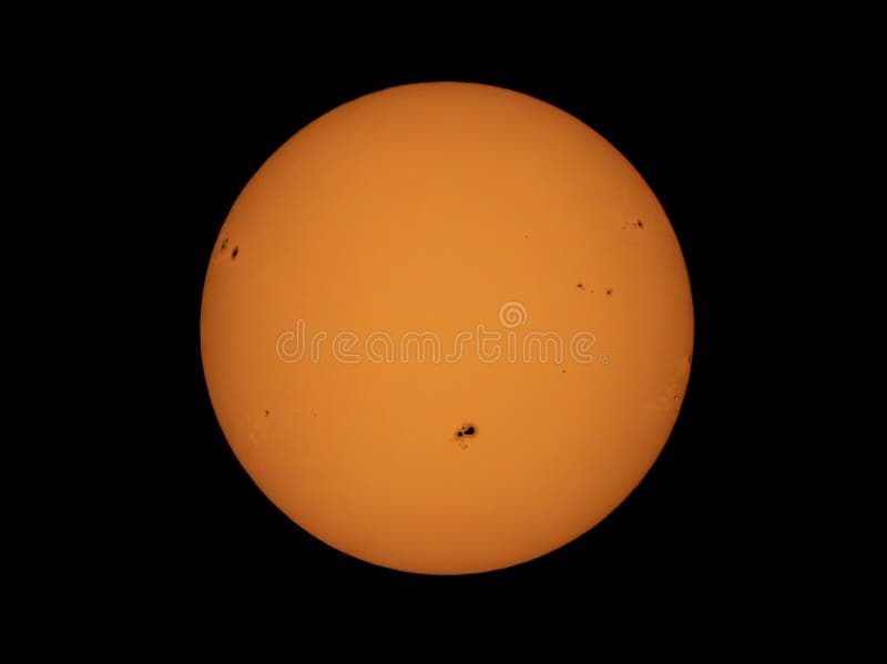 The Orange Coloured Afternoon Sun Glowing with Many Sunspots Using a ...