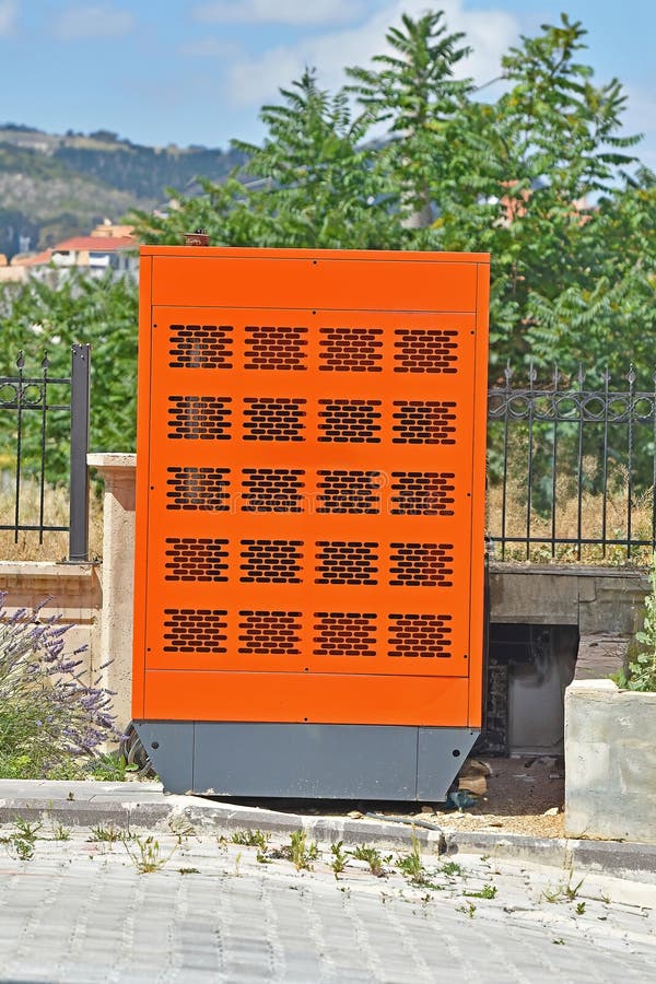 Orange Coloured Industrial Generator Placed in the Field. Stock Image ...