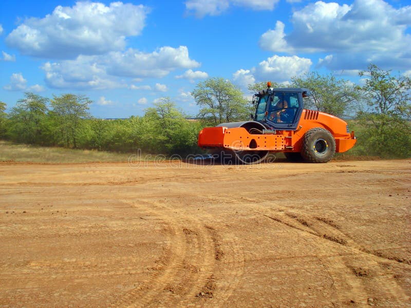 Orange compactor machinery stock image. Image of pressing - 111991095