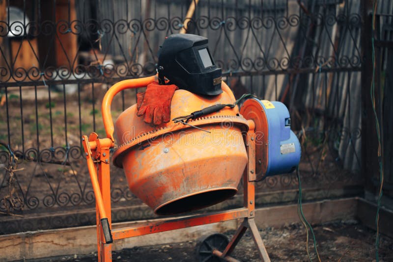 Orange Concrete Mixer at the Construction Site, Foundation Tools Stock ...