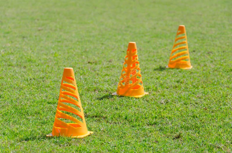 Orange Cone Markers on the Green Grass Stock Photo - Image of orange ...