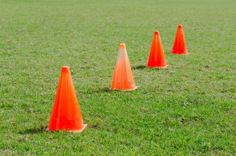 Orange Cone Markers on the Green Grass Stock Photo - Image of green ...