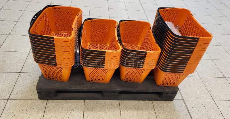 Orange Consumer Baskets are Stacked in the Store. Stock Image - Image ...