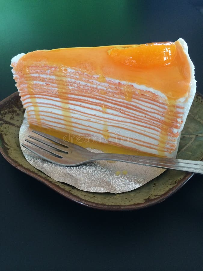 Orange Crepe Cake with Fork Stock Image - Image of sauce, sweet: 42598861