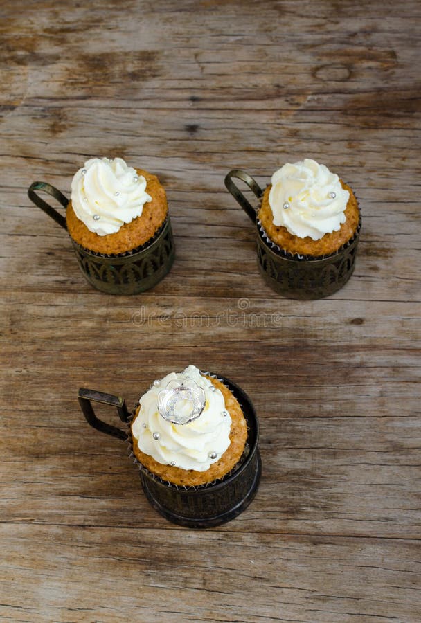 Orange Crown Muffins into the Silver Glass-holder Stock Photo - Image ...