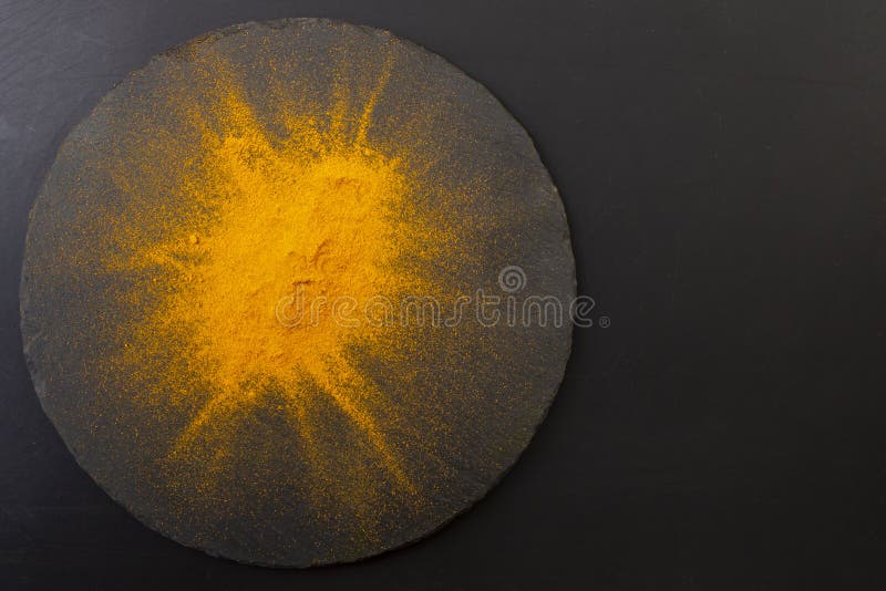 Orange Curry Powder Explosion on Black Stone Texture Stock Photo ...