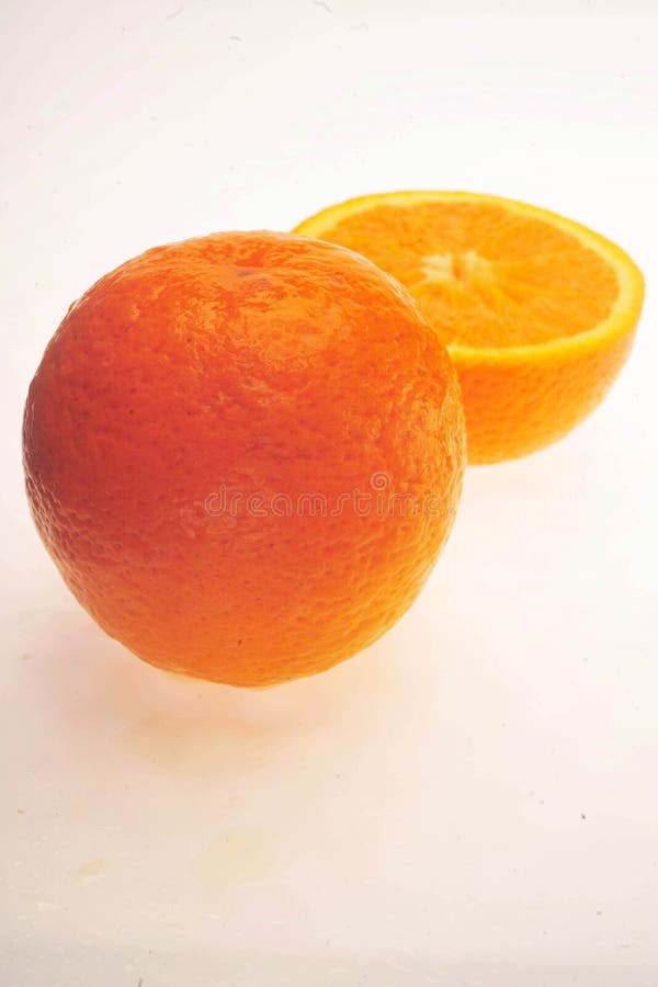 Orange with Cut in Half and Green Leaves Isolated on White Background ...