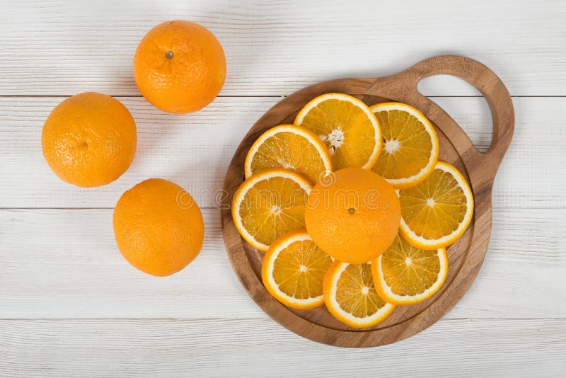 Orange is Cut into Slices and Well Decorated on Cutting Board Stock ...