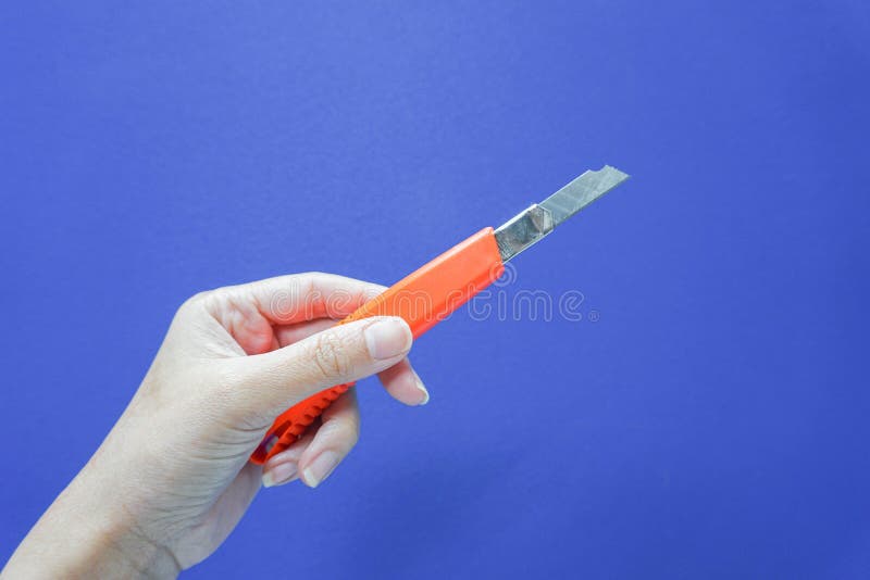 Orange Cutter in Woman Hand Stock Image - Image of cutter, crafts: 82111663