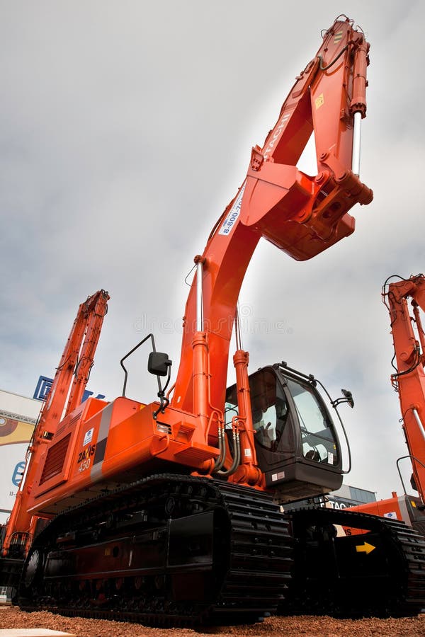 Orange diesel excavator editorial image. Image of black - 20638215