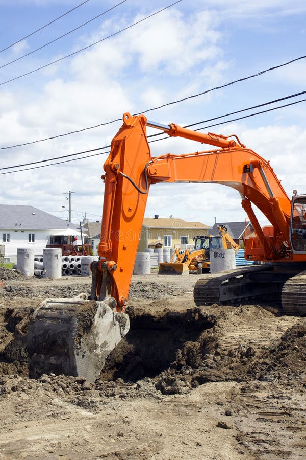 Orange Digger and Deep Hole Stock Image - Image of blue, expansion ...