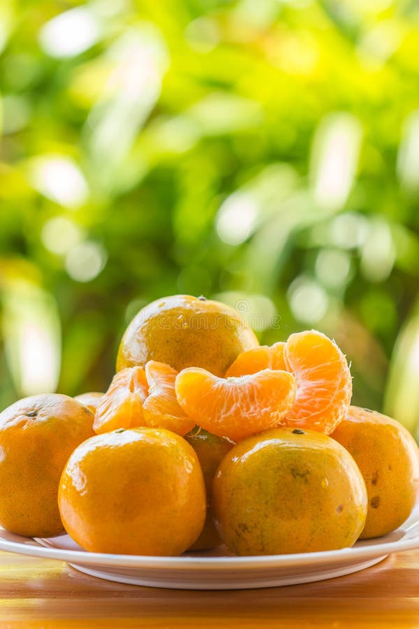 Orange on Dish on Wooden Table Stock Image - Image of orange, bokeh ...