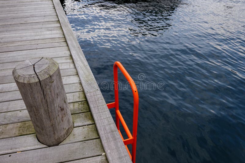 Orange Dock Ladder and Wooden Floor Over Water. Stock Photo - Image of ...