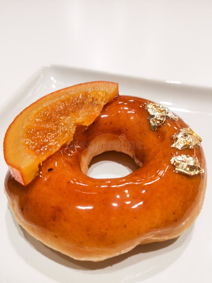 Orange Donut with Gold Leaf Stock Photo - Image of leaf, empty: 280263436
