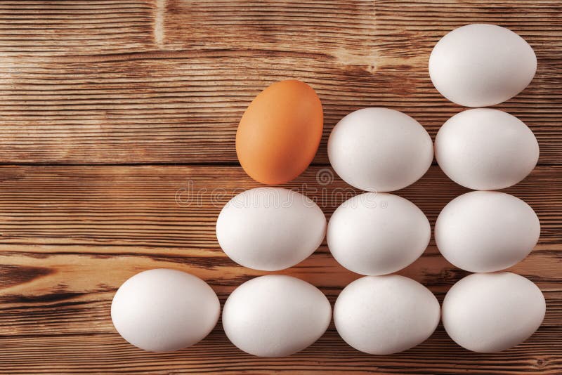 An Orange Egg Goes Up a Ladder of White Eggs Stock Image - Image of ...