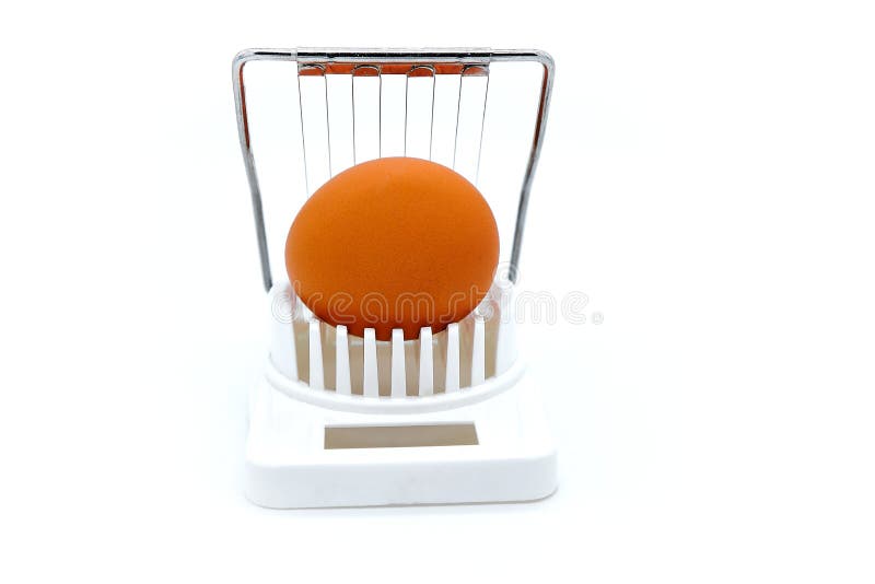 Orange Egg in a Slicer. Kitchen Device for Cutter Eggs Stock Image ...