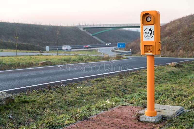 Orange Emergency Call Post on a Highway Stock Image - Image of ...