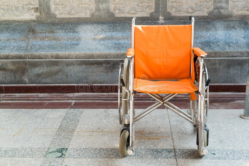 Orange empty wheelchair stock photo. Image of personal - 65813570