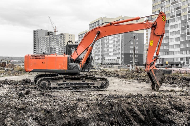 Orange Excavator on a Construction Site Stock Photo - Image of factory ...