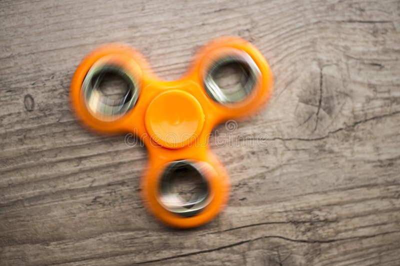 Orange fidget spinner stock photo. Image of element, entertainment ...