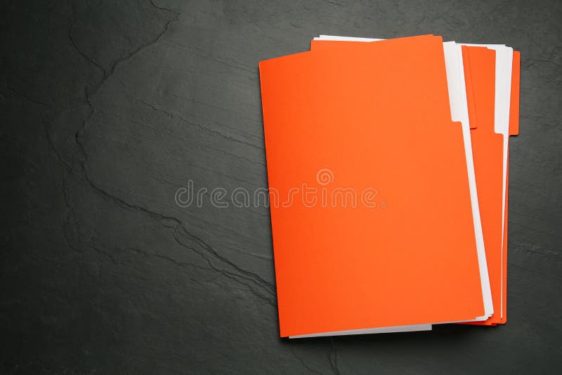 Orange Files with Documents on Black Slate Table, Top View. Space for ...