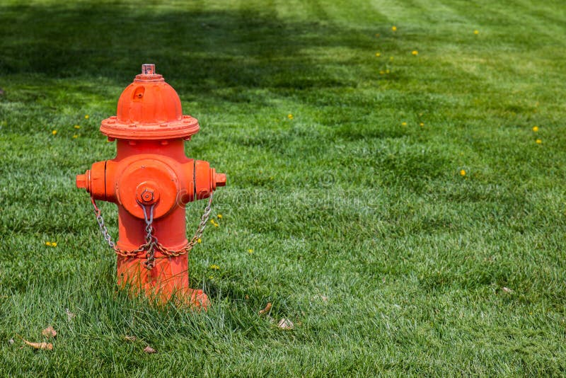 Orange Fire Hydrant in Field Stock Photo - Image of help, chains: 91342608
