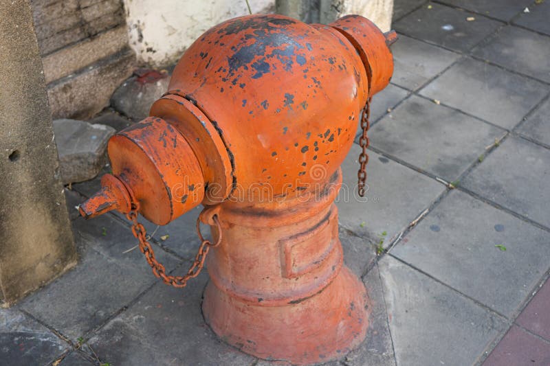 An Orange Fire Hydrant with Worn Paint. Stock Image - Image of ...