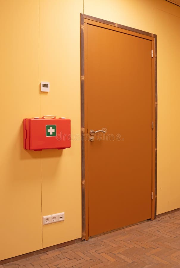 Orange First Aid Case Hanging on the Wall Stock Photo - Image of study ...