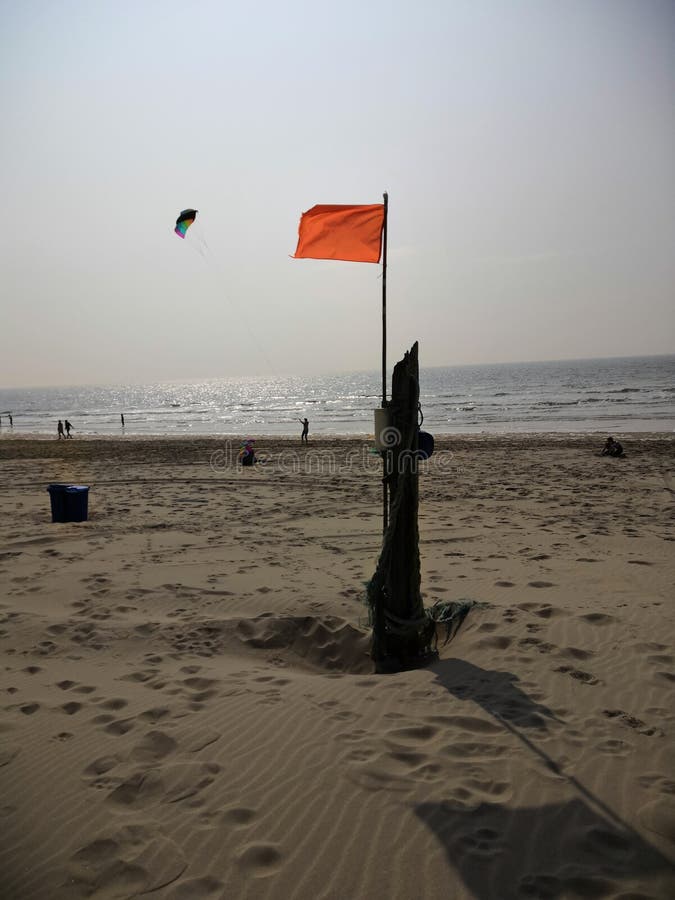 Orange flag on the beach stock photo. Image of orange - 150623286